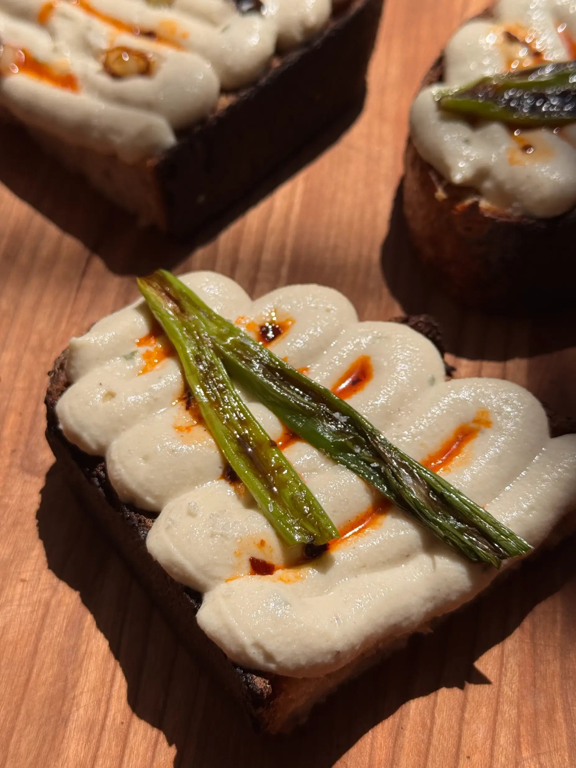 Scallion chili oil whipped cream cheese toasts – Miyoko's Creamery
